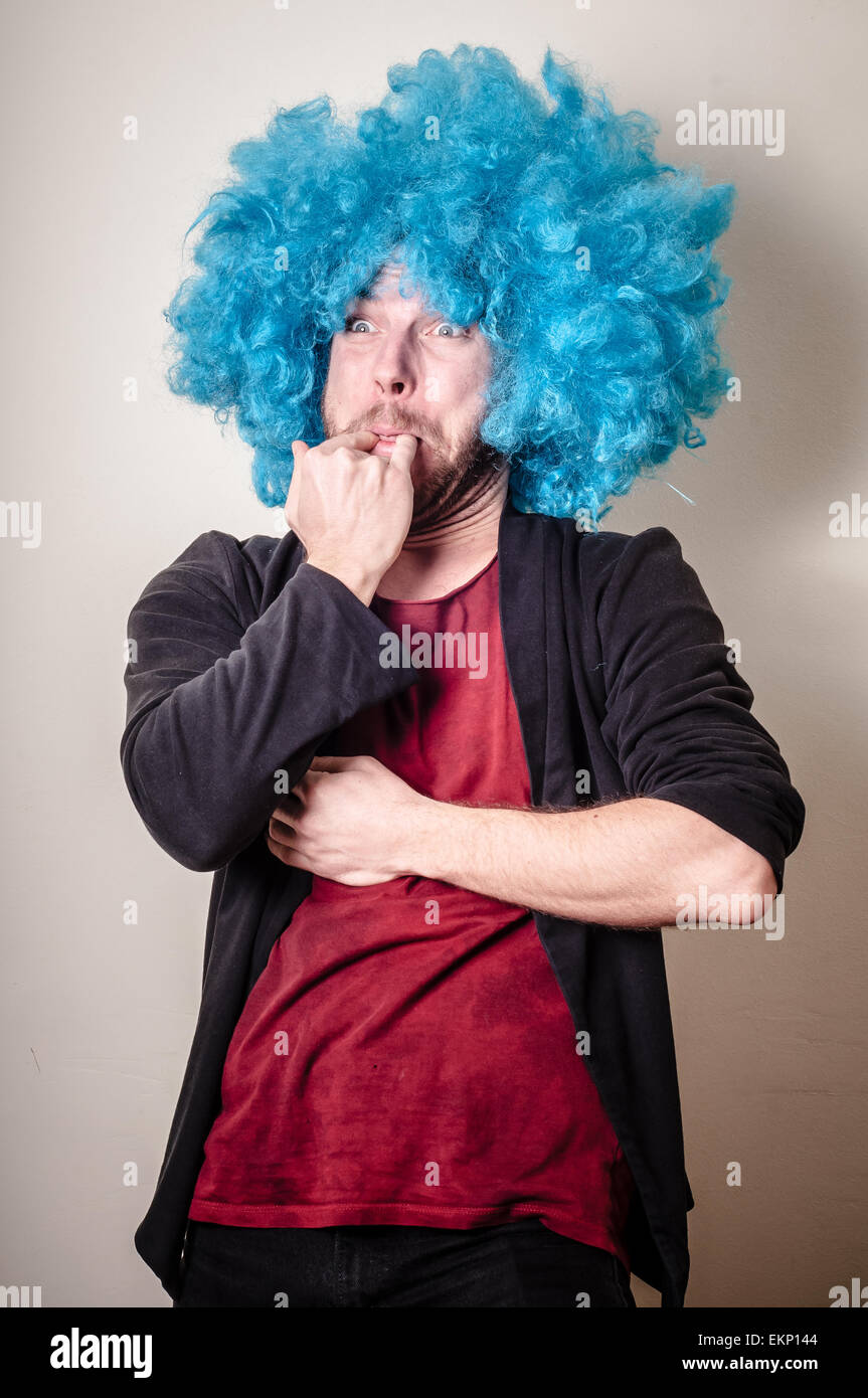 hipster stylish funny man with blue wig Stock Photo - Alamy