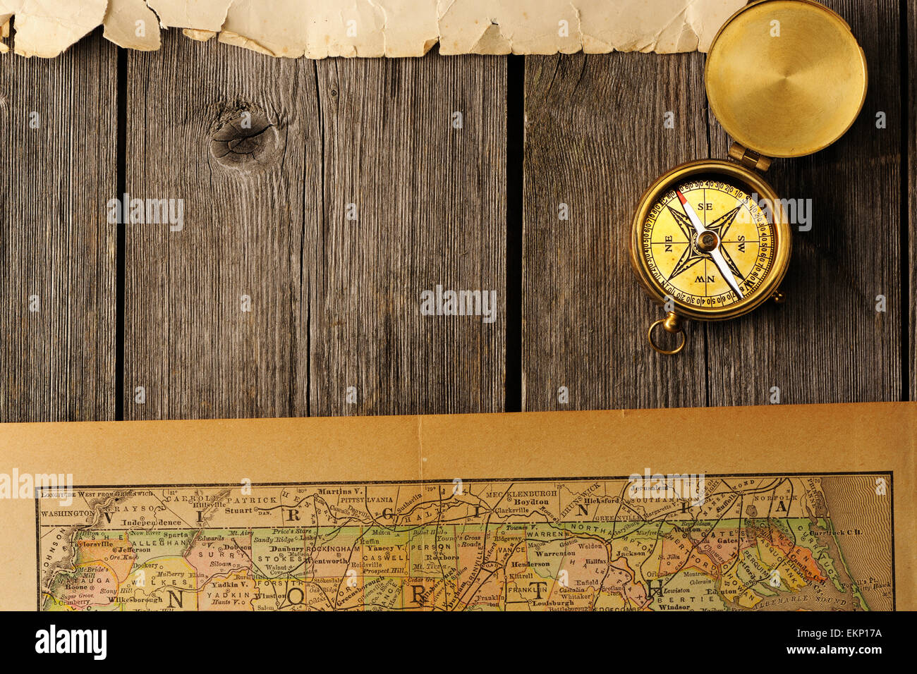 Antique compass over old map Stock Photo - Alamy