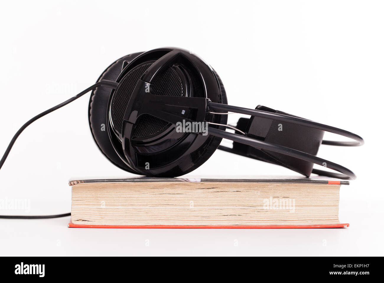 Headphones and book on a white background Stock Photo - Alamy