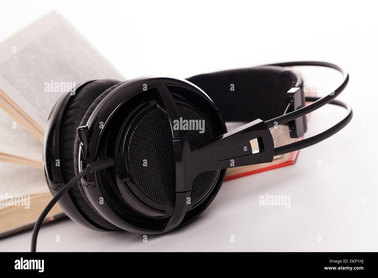 Headphones and book on a white background Stock Photo - Alamy