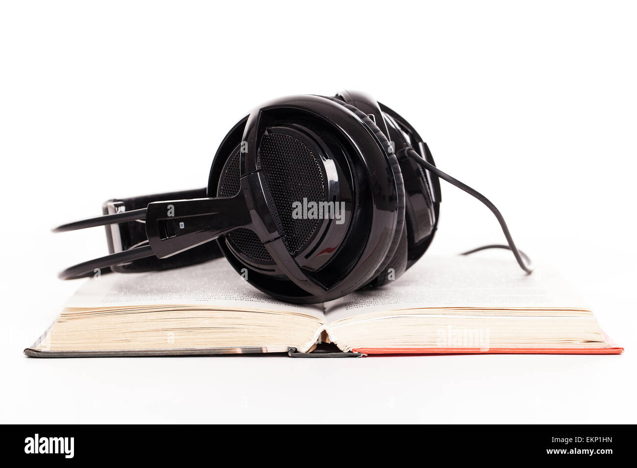 Headphones and book on a white background Stock Photo - Alamy