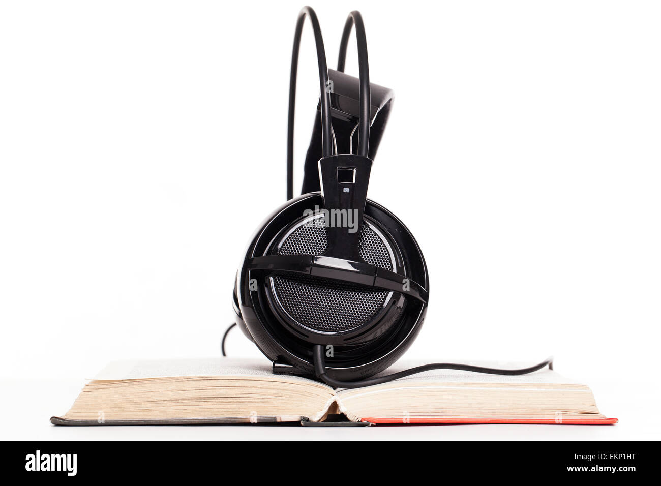 Headphones and book on a white background Stock Photo - Alamy