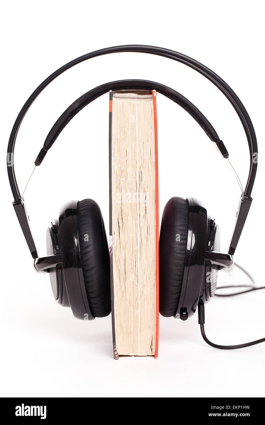 Headphones and book on a white background Stock Photo - Alamy