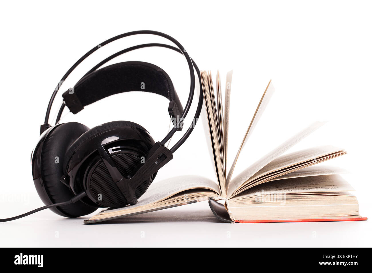 Headphones and book on a white background Stock Photo - Alamy