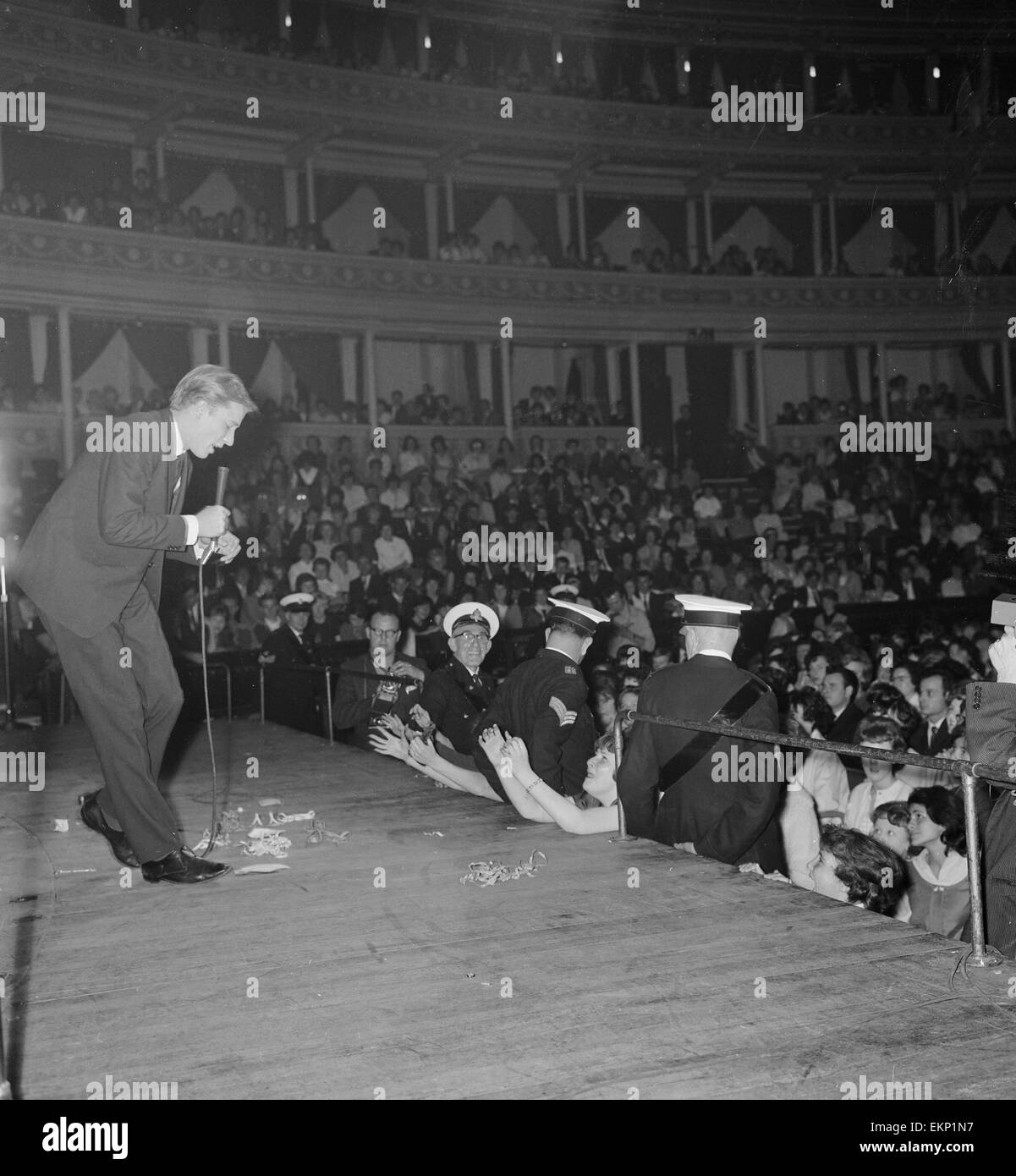 British pop singer Mike Sarne performing on stage at the Pop Prom at ...