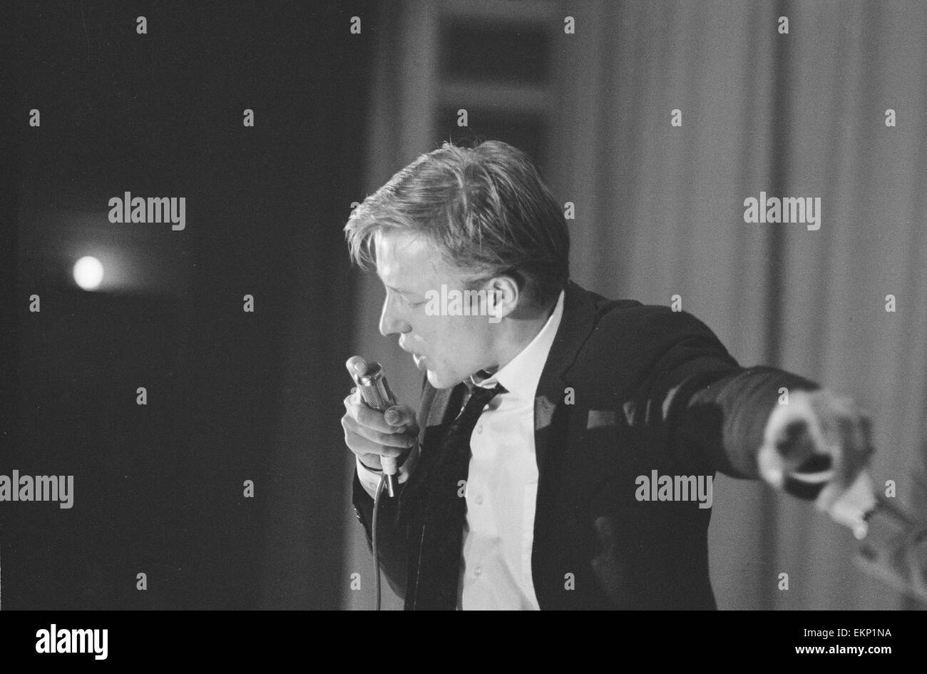 British pop singer Mike Sarne performing on stage with his band. 12th ...