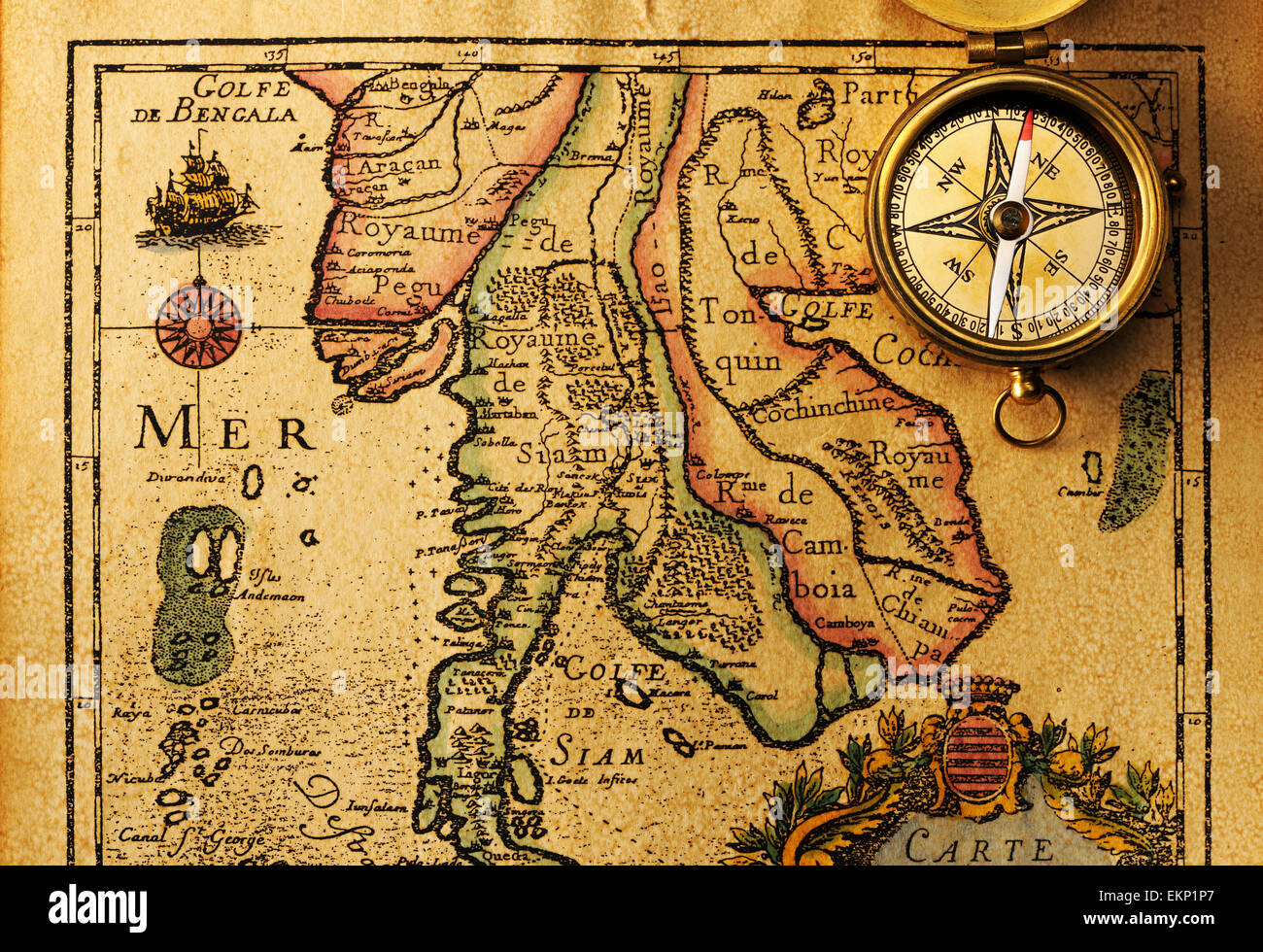 Antique compass over old map Stock Photo - Alamy