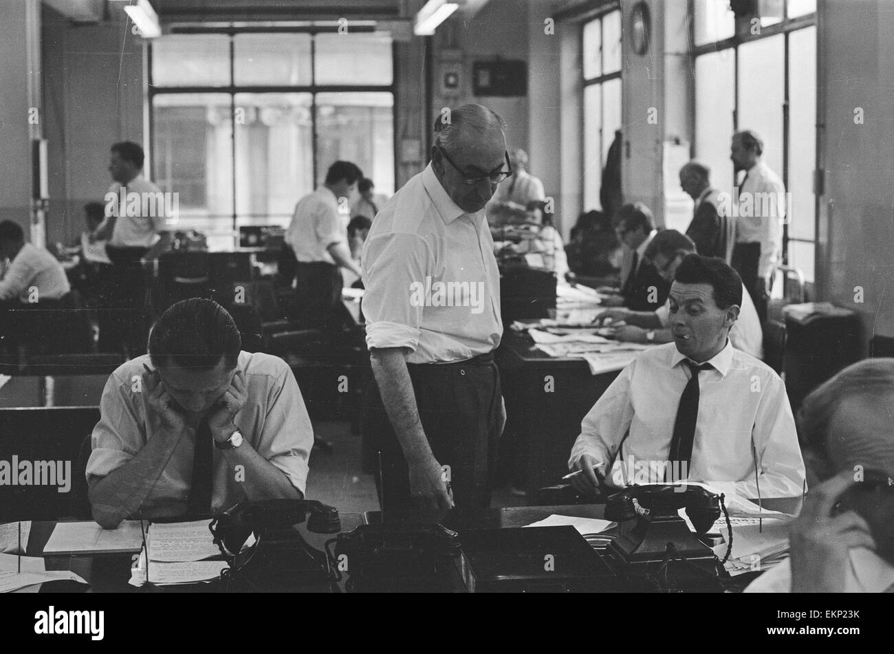 Busy scenes on the Daily Herald news desk, 1964 Stock Photo - Alamy