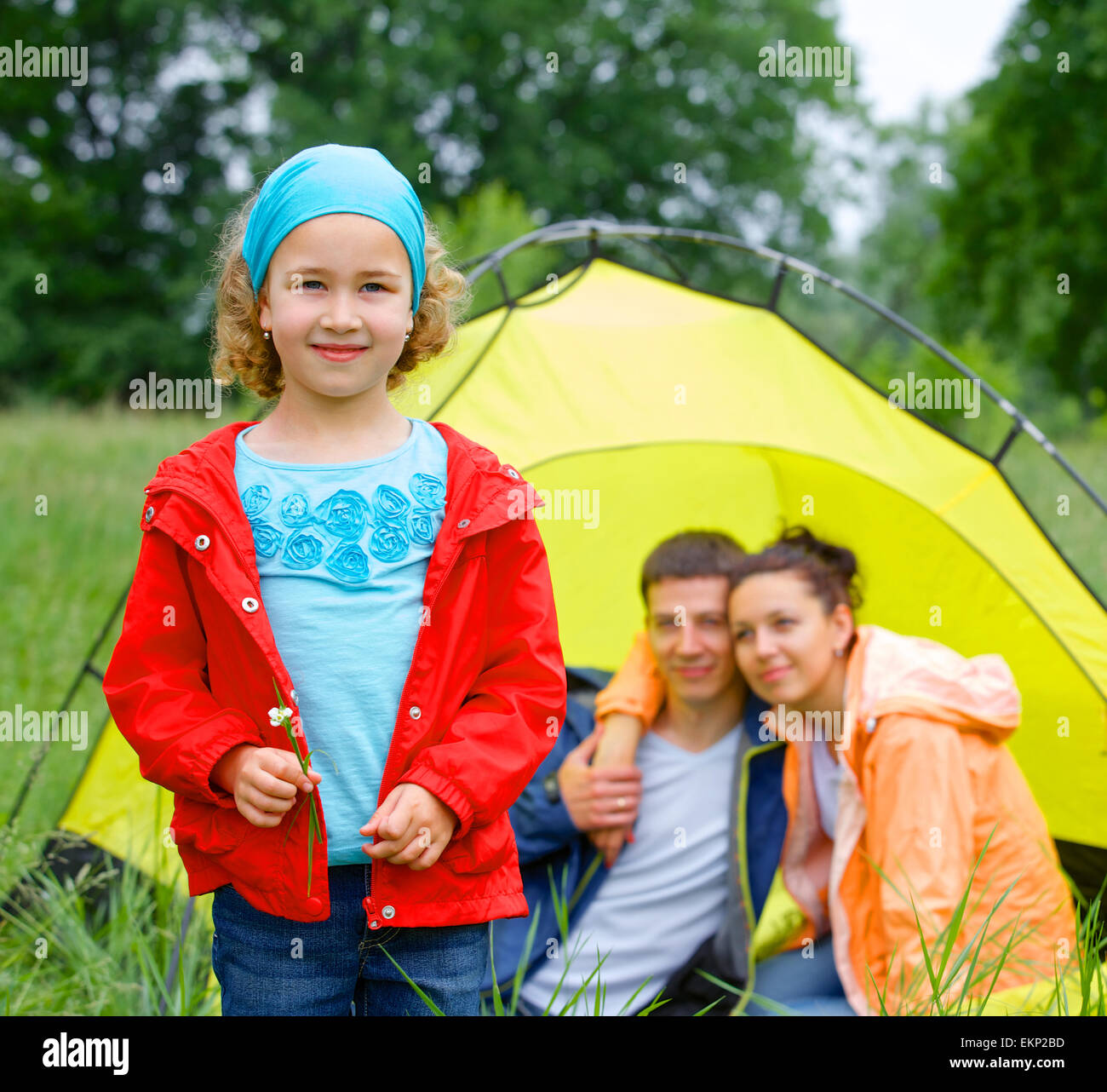 Young girl camping Stock Photo - Alamy