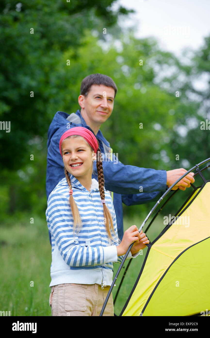Young girl camping Stock Photo - Alamy