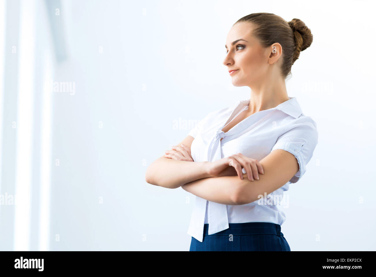 Cheerful business woman stands hi-res stock photography and images - Alamy