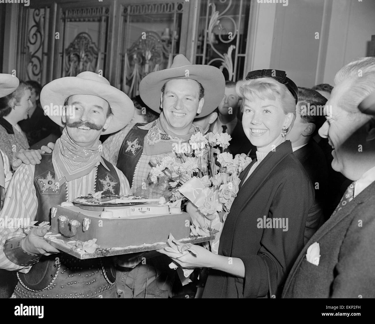 American singer and actress Doris Day pictured with men dressed in ...