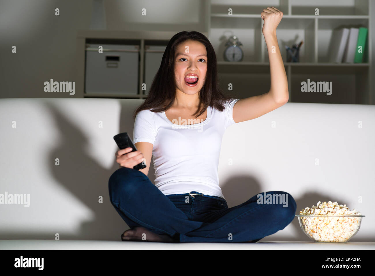 beautiful young girl watching TV Stock Photo - Alamy