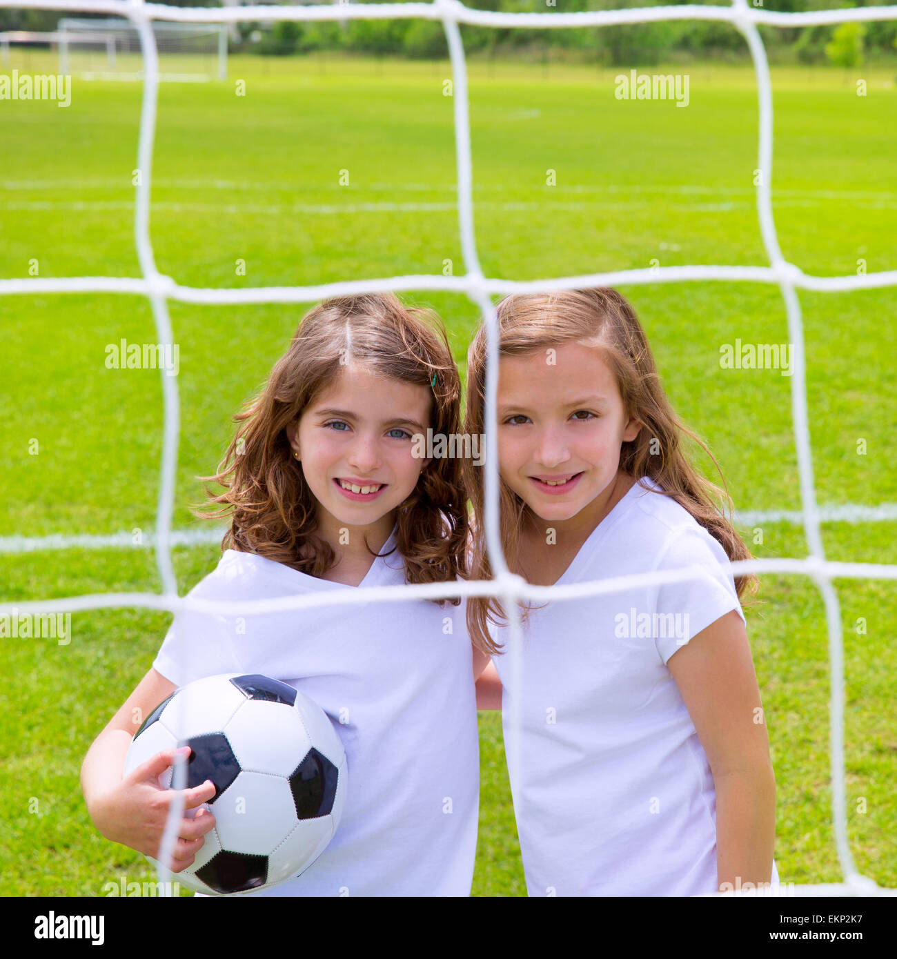Soccer football kid girls playing on field Stock Photo - Alamy