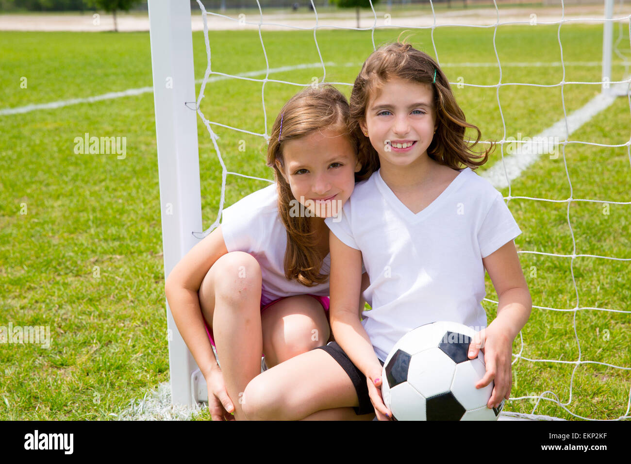 Soccer football kid girls playing on field Stock Photo - Alamy
