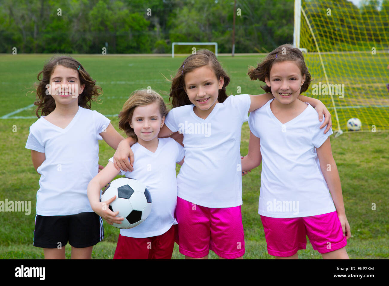 Soccer football kid girls team at sports fileld Stock Photo - Alamy