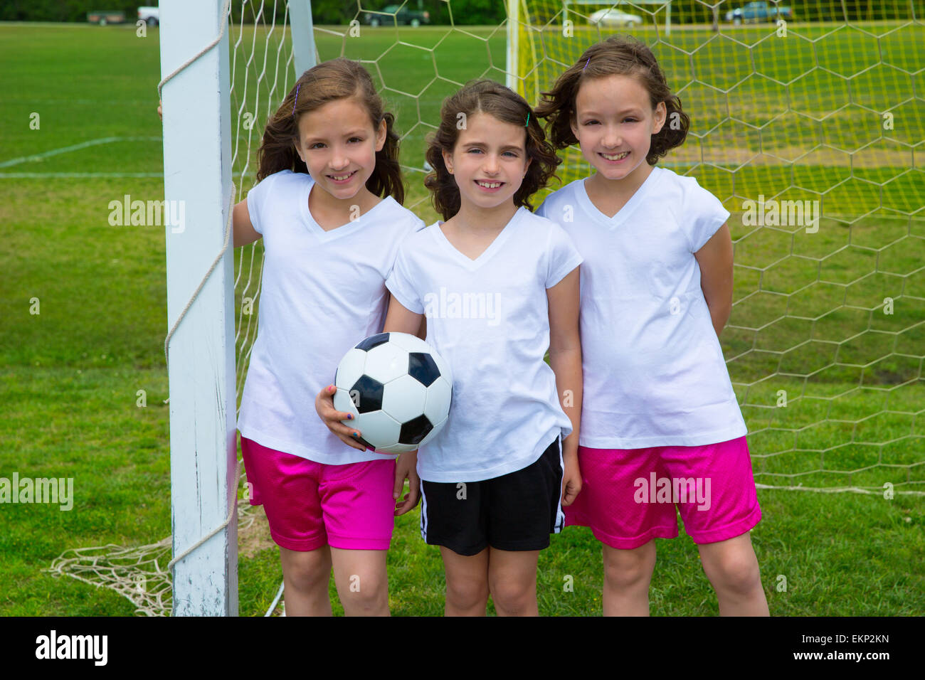 Soccer football kid girls team at sports fileld Stock Photo - Alamy