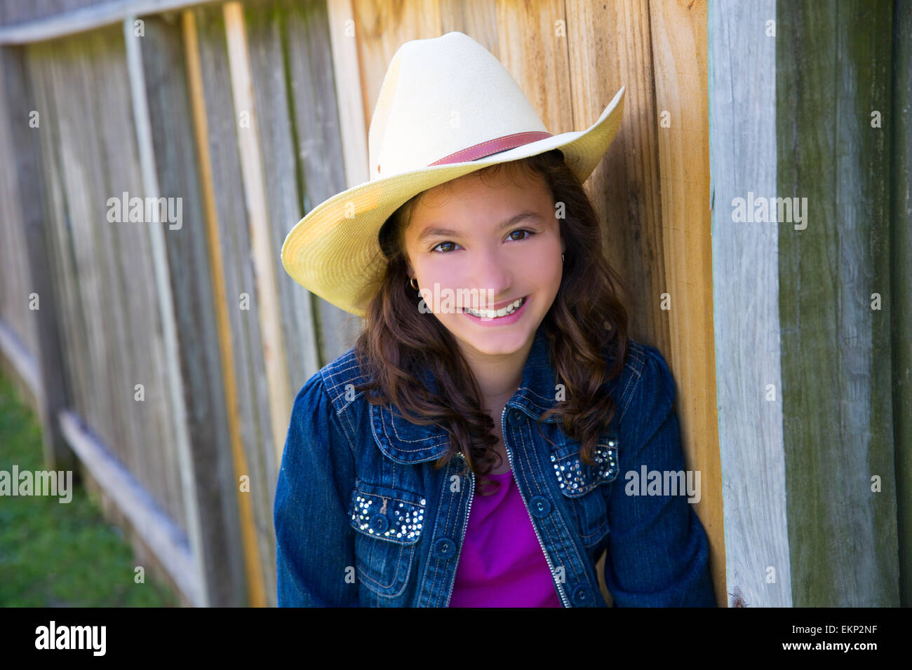Little kid girl pretending to be a cowboy with hat Stock Photo - Alamy