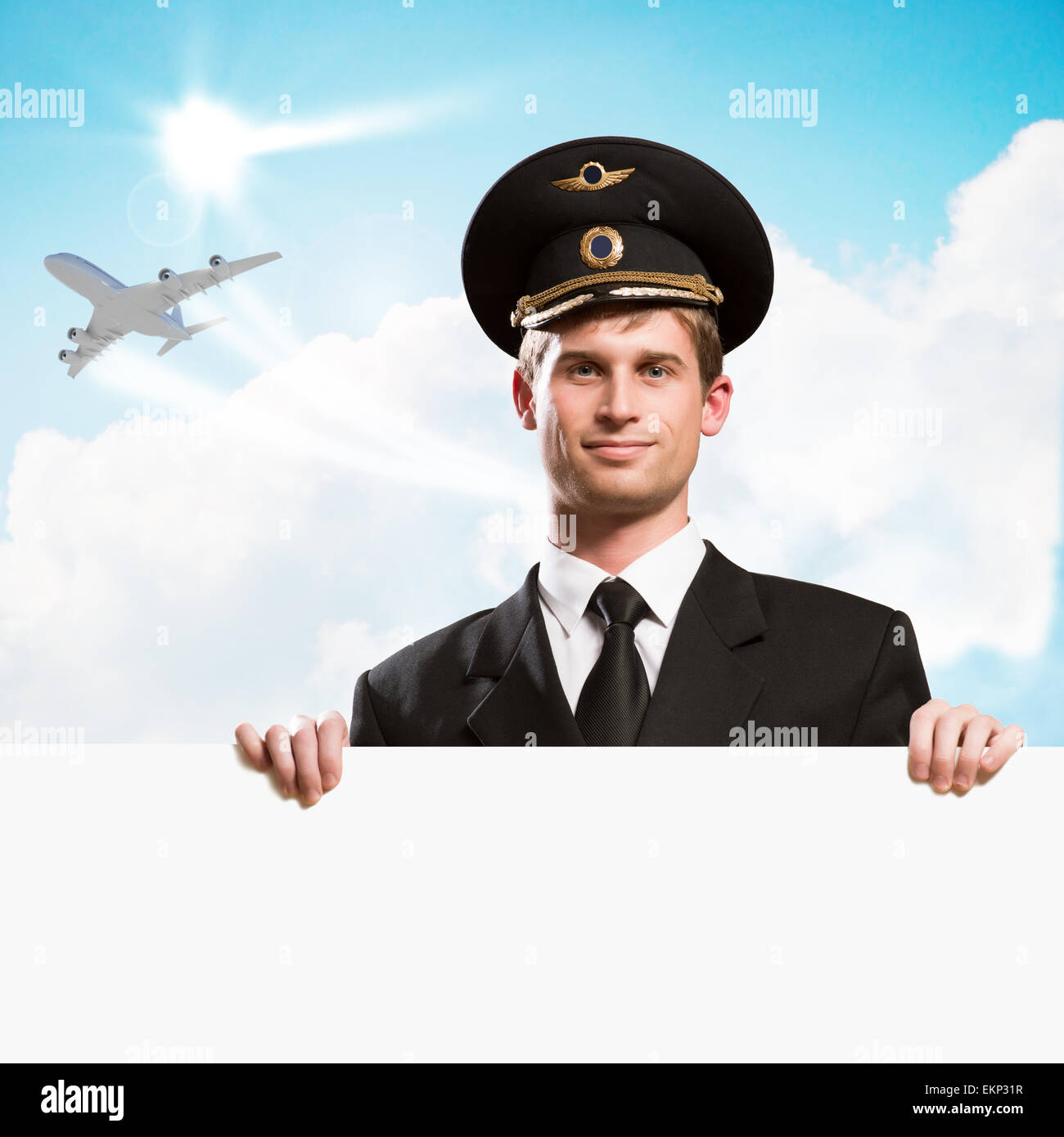 pilot in the form of holding an empty billboard Stock Photo - Alamy