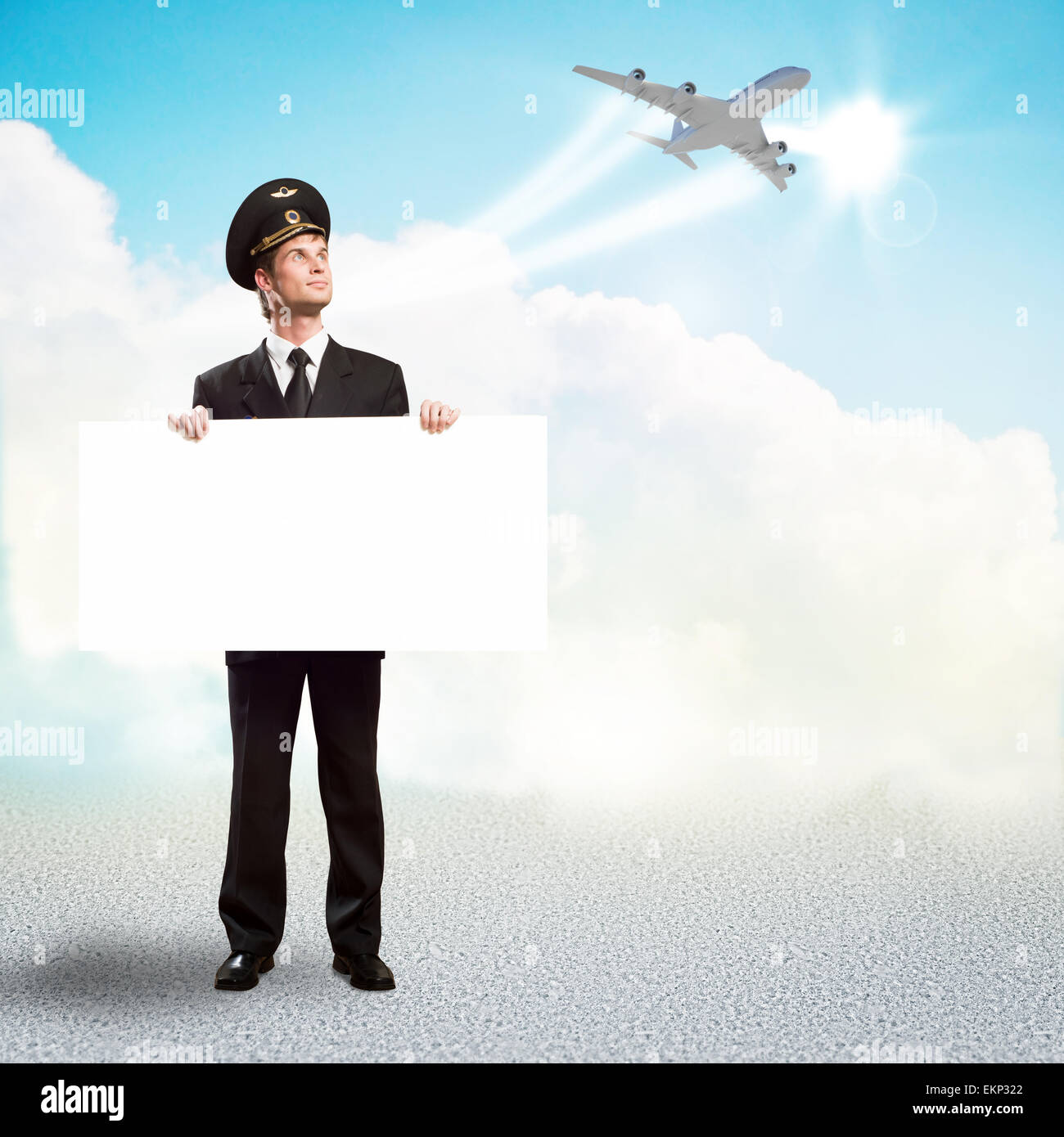 pilot in the form of holding an empty billboard Stock Photo - Alamy