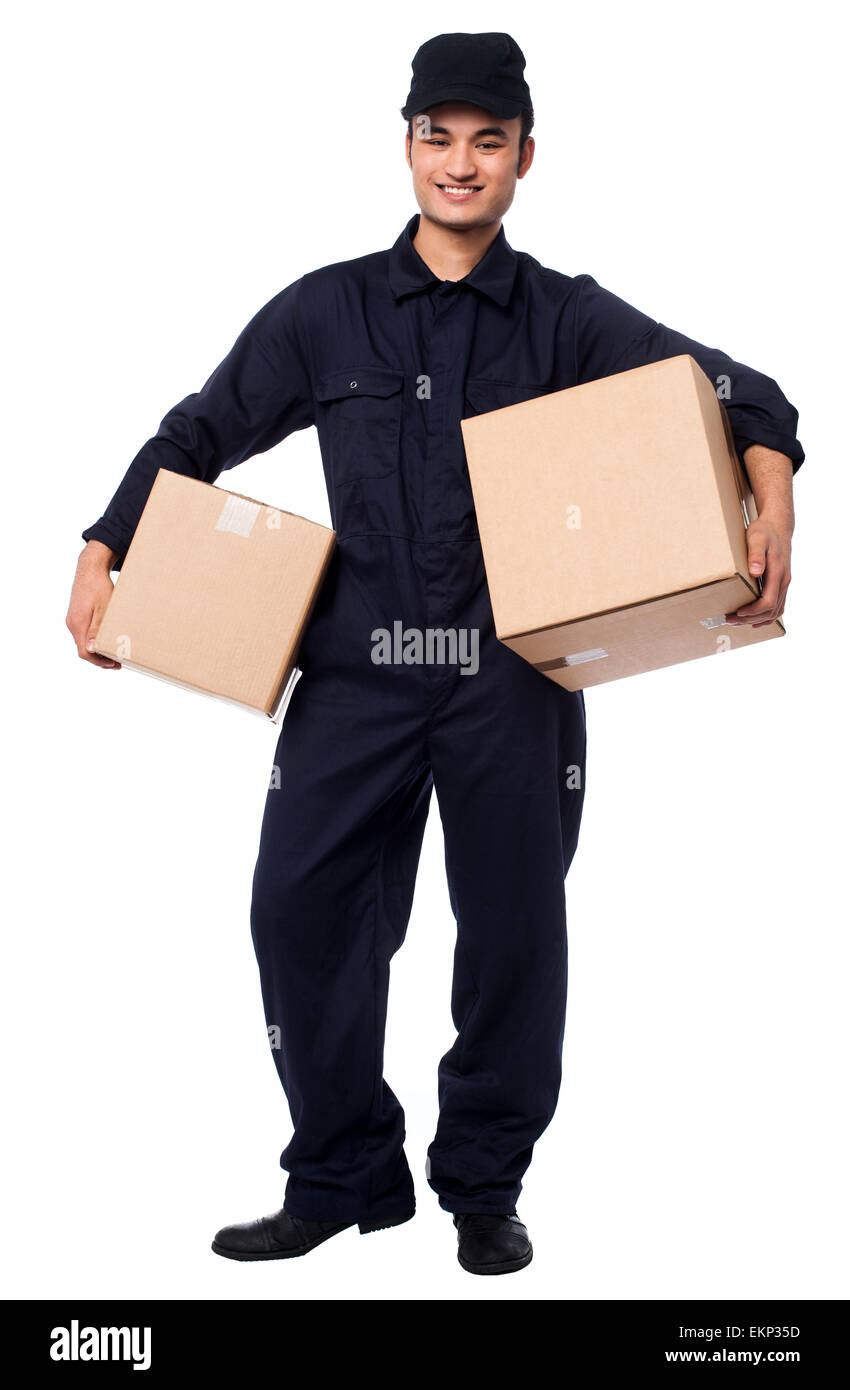 Young courier boy holding parcels Stock Photo - Alamy