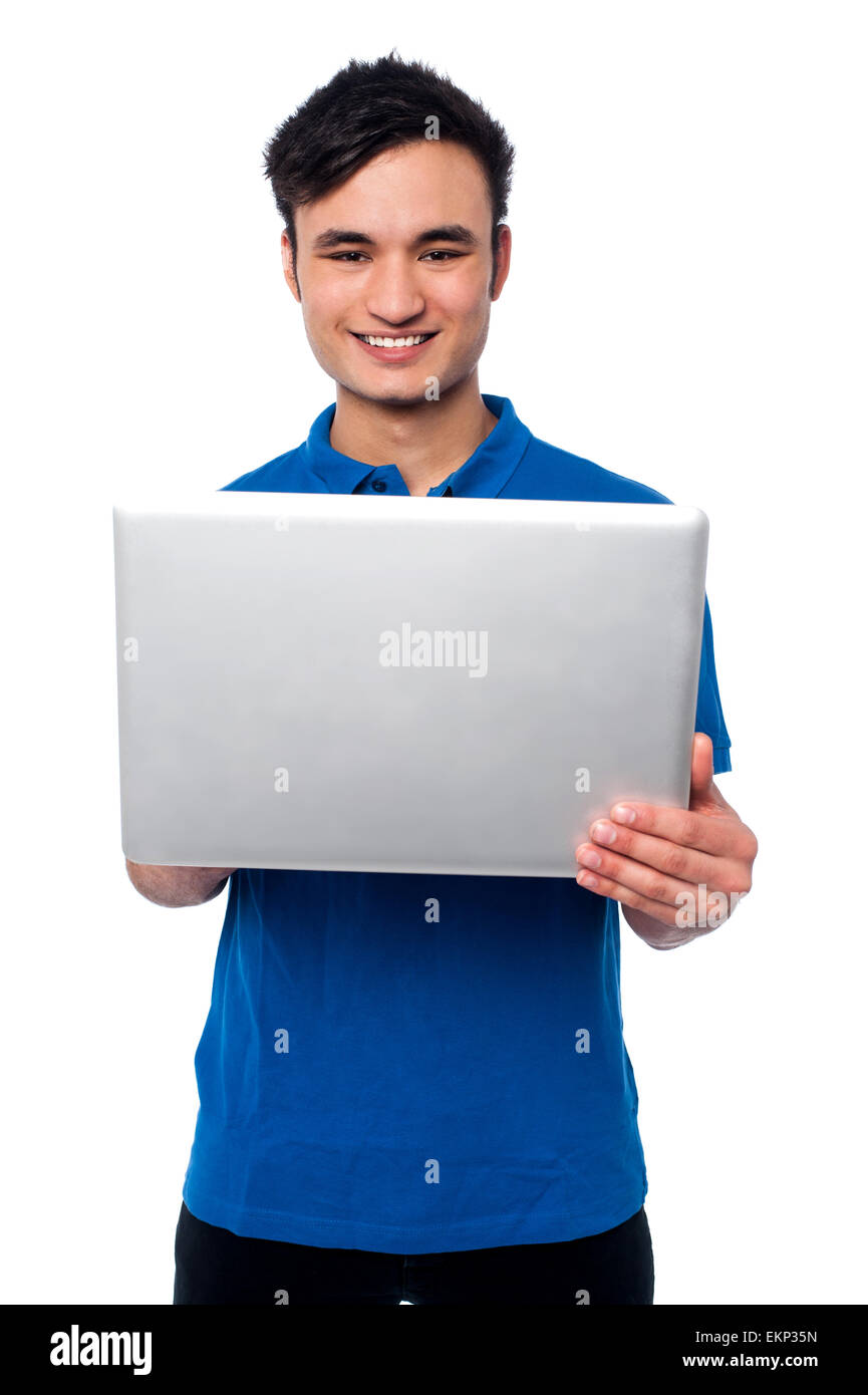 Young guy holding laptop Stock Photo - Alamy