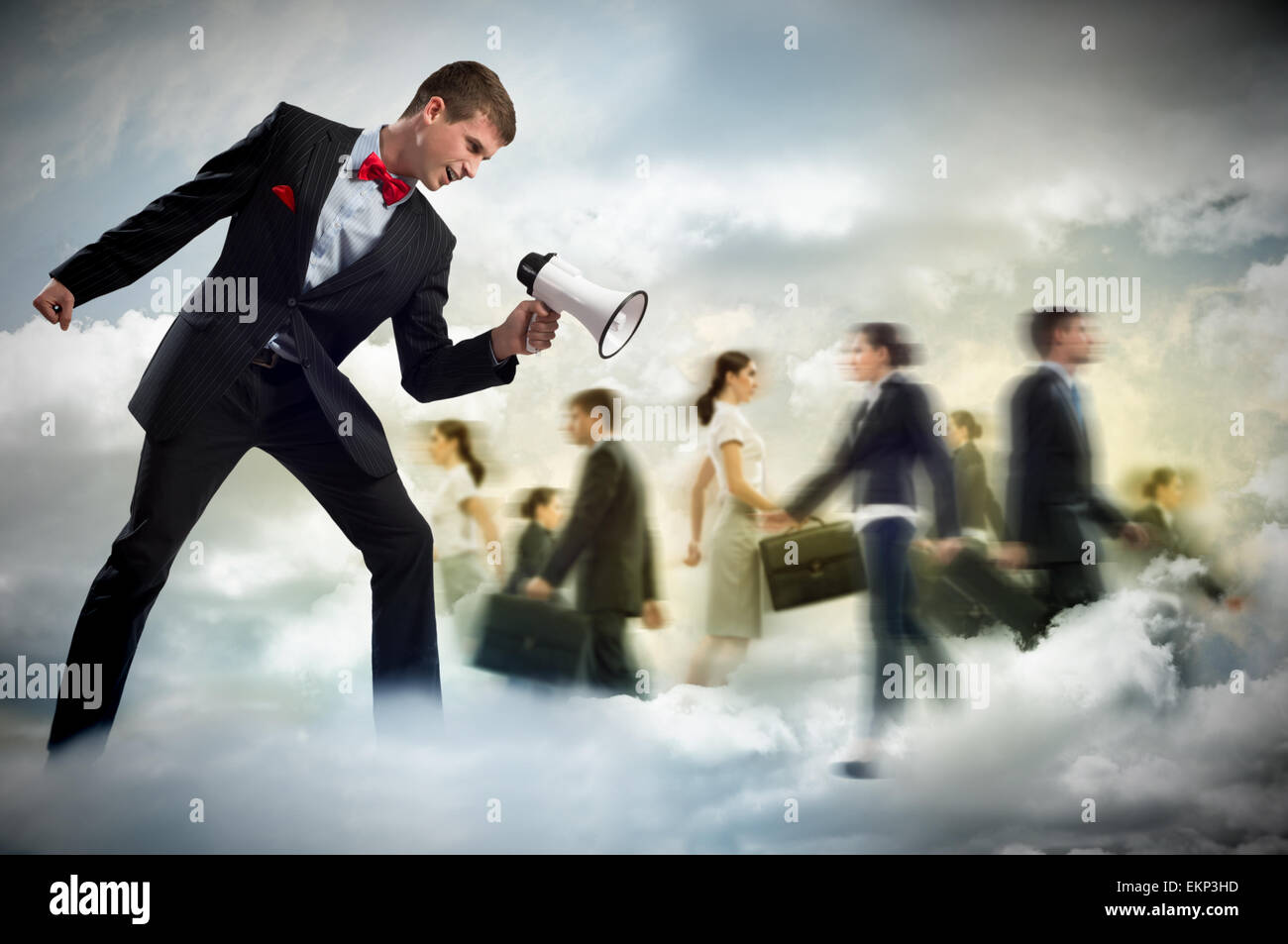 man shouting into a megaphone at the crowd Stock Photo - Alamy