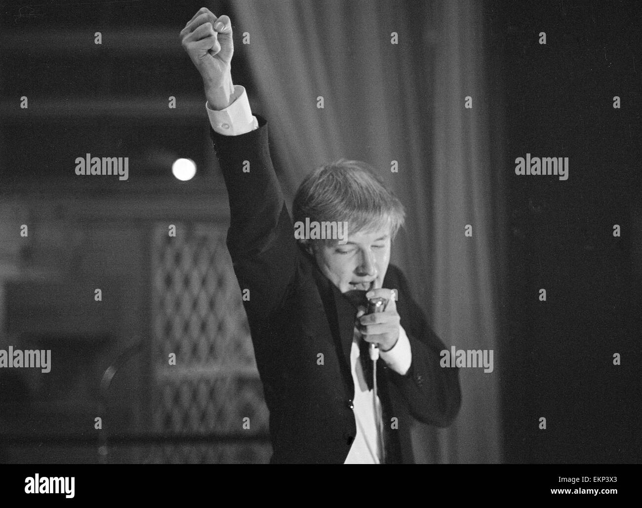 British pop singer Mike Sarne performing on stage with his band. 12th ...