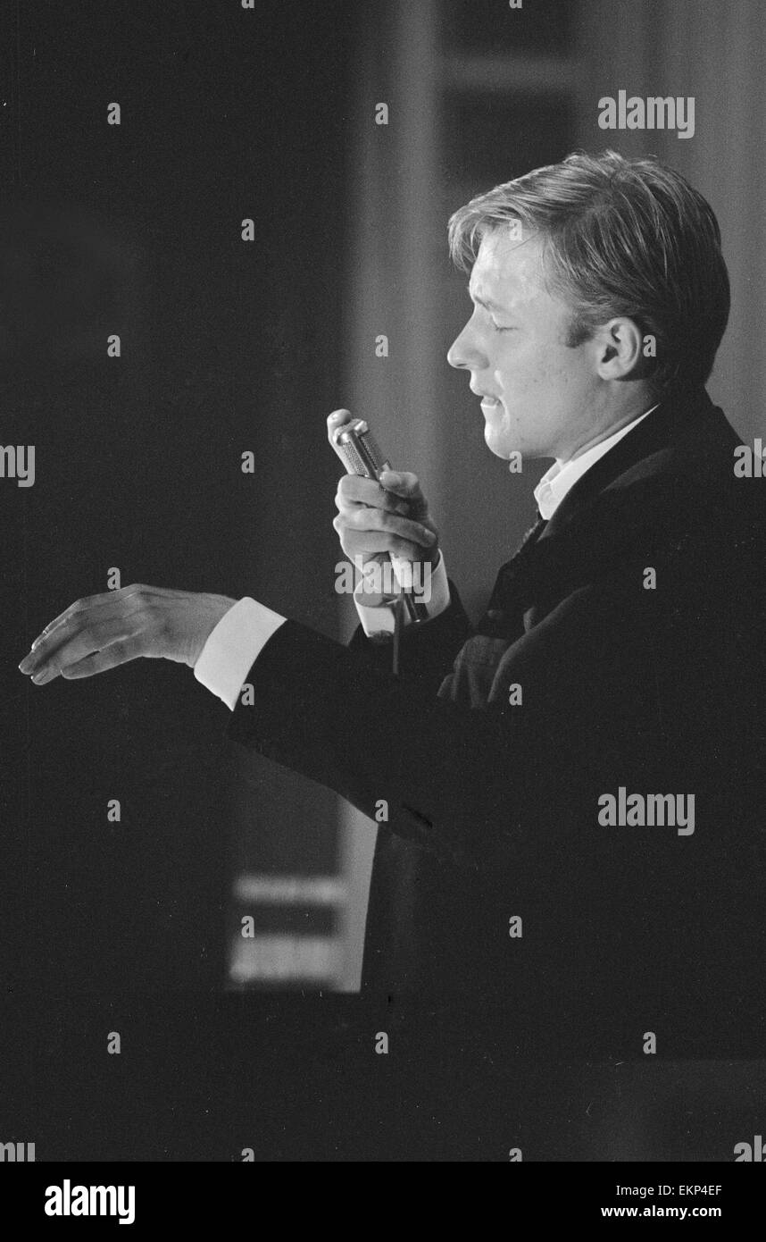 British pop singer Mike Sarne performing on stage with his band. 12th ...