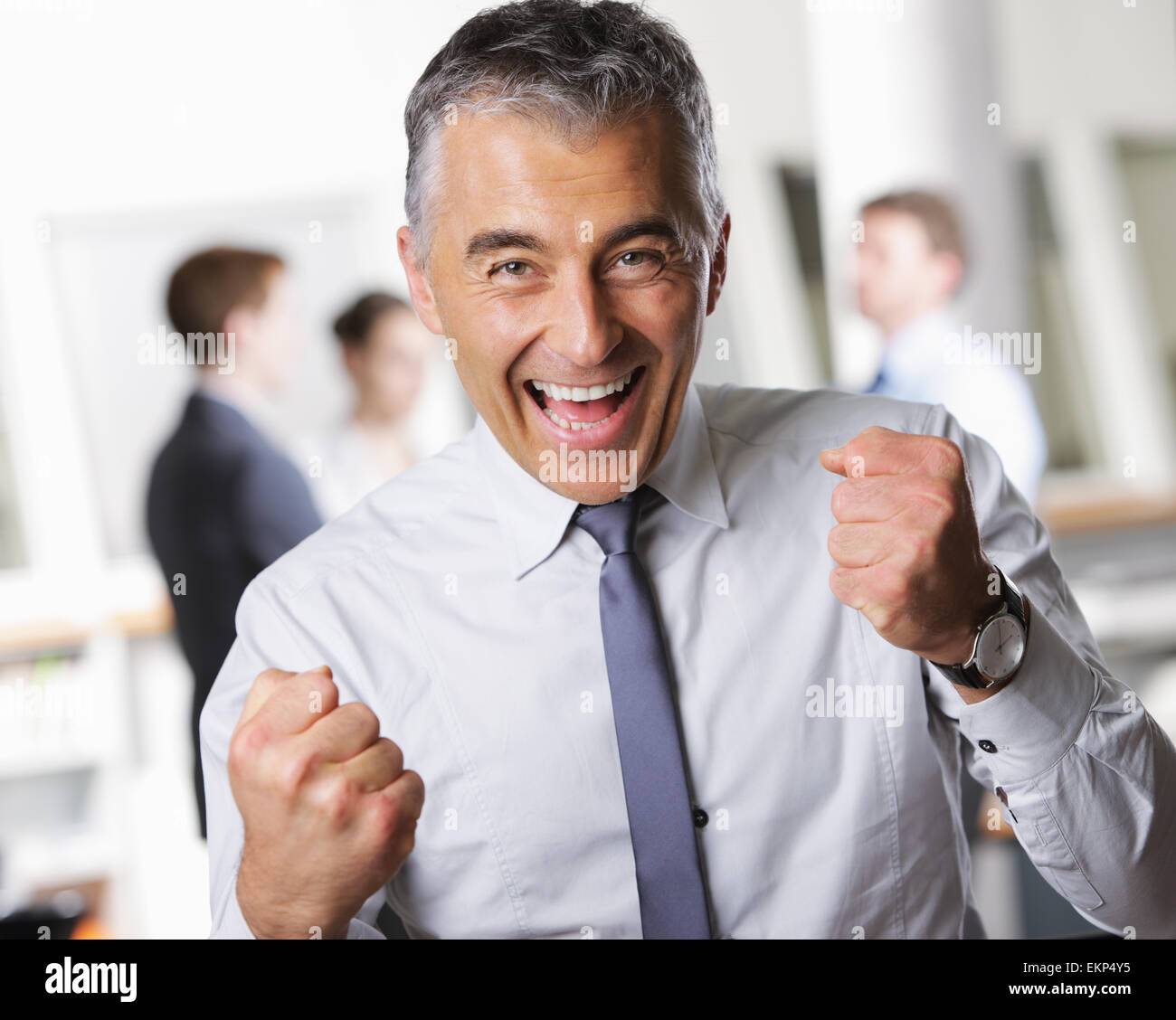 Business man celebrating his success Stock Photo - Alamy