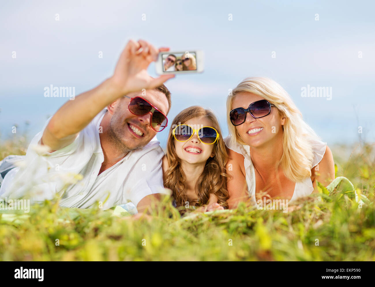 happy family with camera taking picture Stock Photo - Alamy
