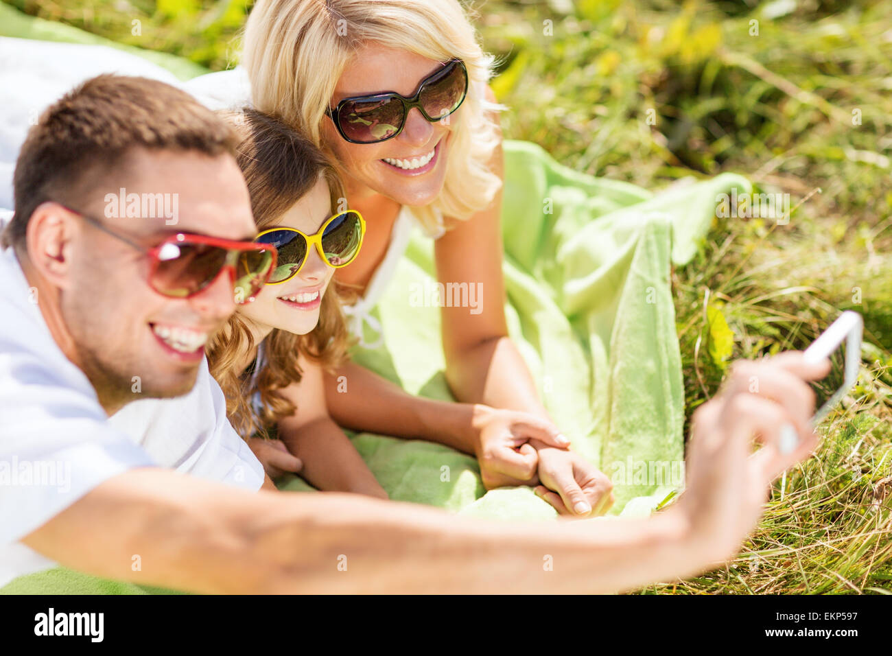 happy family with camera taking picture Stock Photo - Alamy