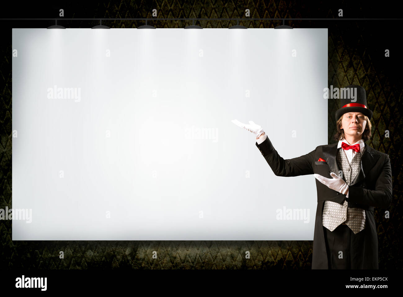 magician in top hat and tie points to the banner Stock Photo - Alamy