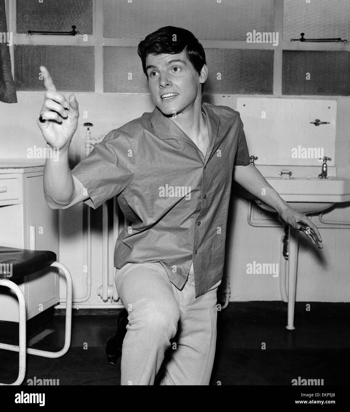 Singer Jess Conrad models a new paper shirt by Teddy Tinling. 12th ...