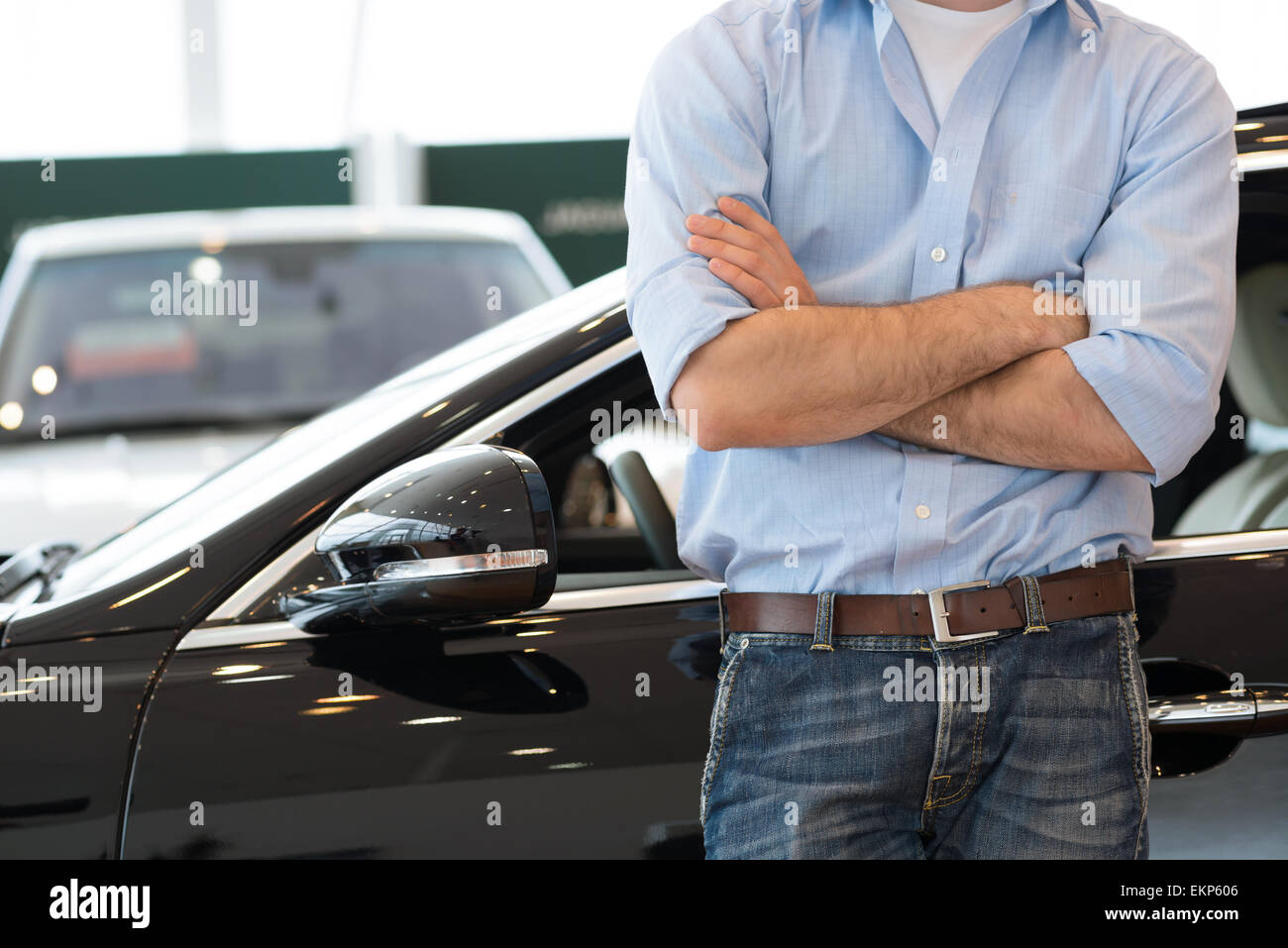 man standing near a car Stock Photo - Alamy