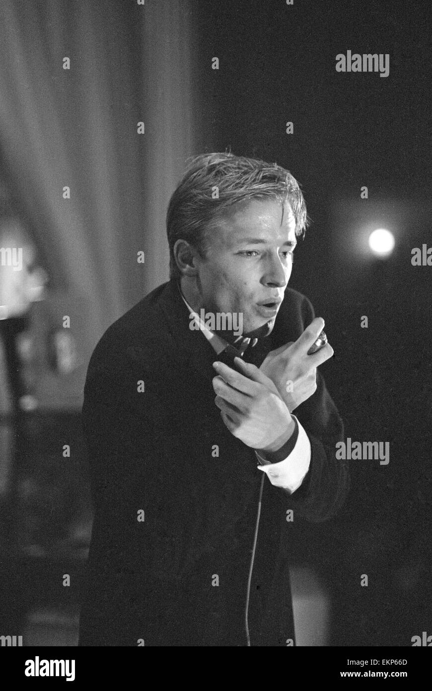 British pop singer Mike Sarne performing on stage with his band. 12th ...