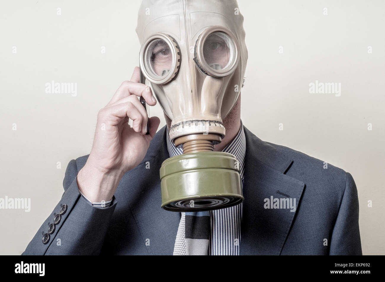 businessman with gas mask with phone Stock Photo - Alamy