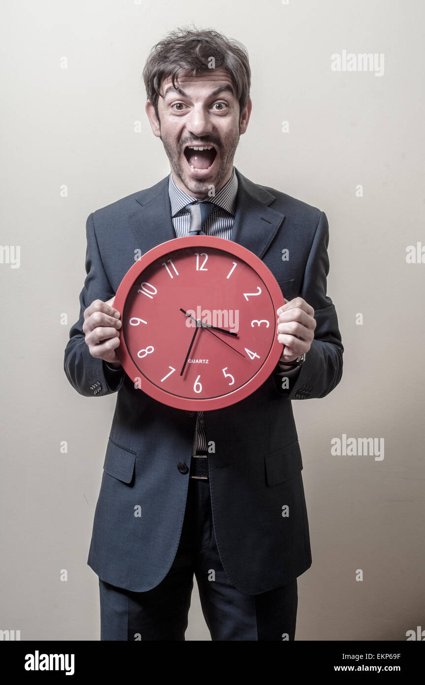 businessman with clock screaming Stock Photo - Alamy