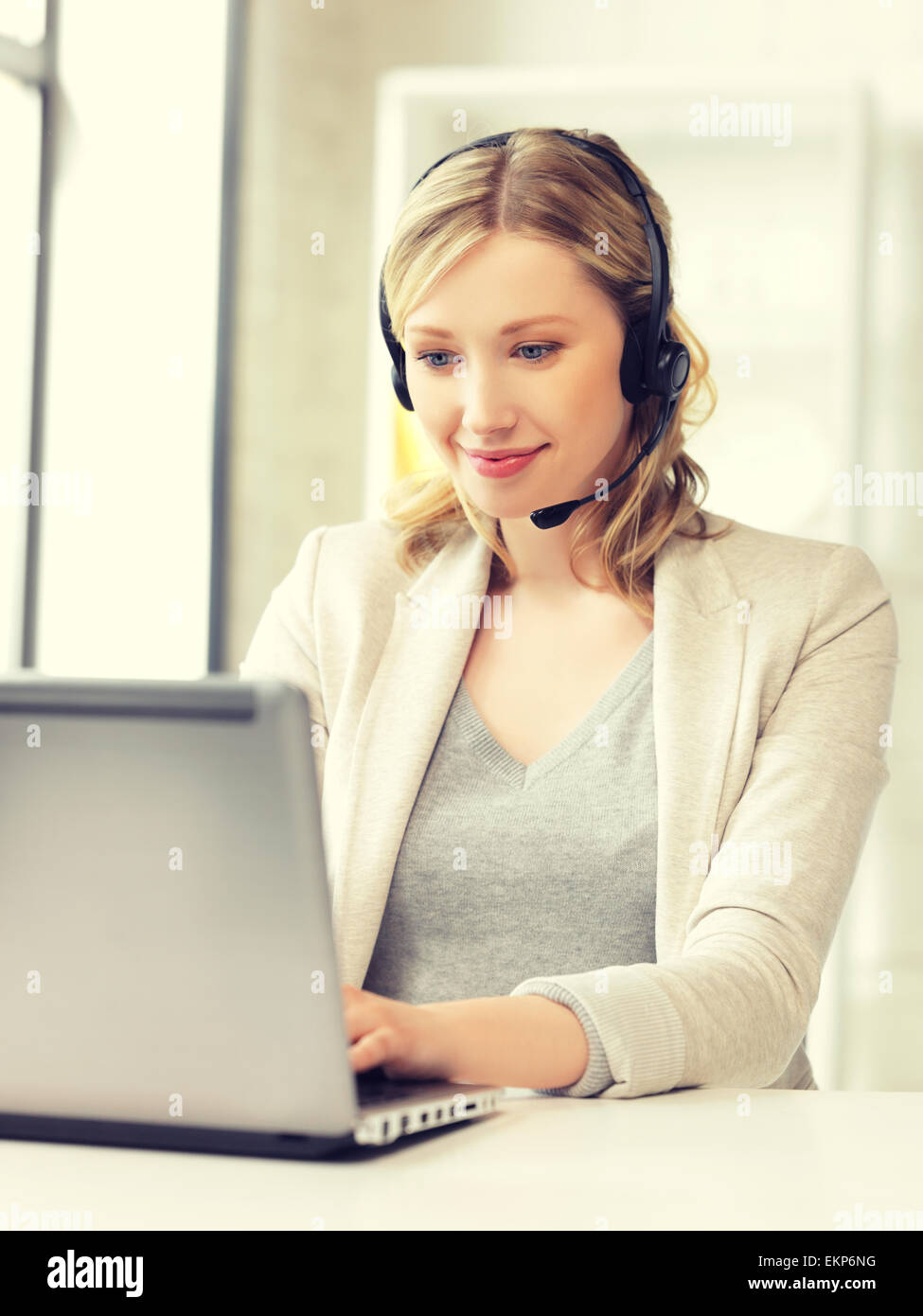 helpline operator with laptop computer Stock Photo - Alamy