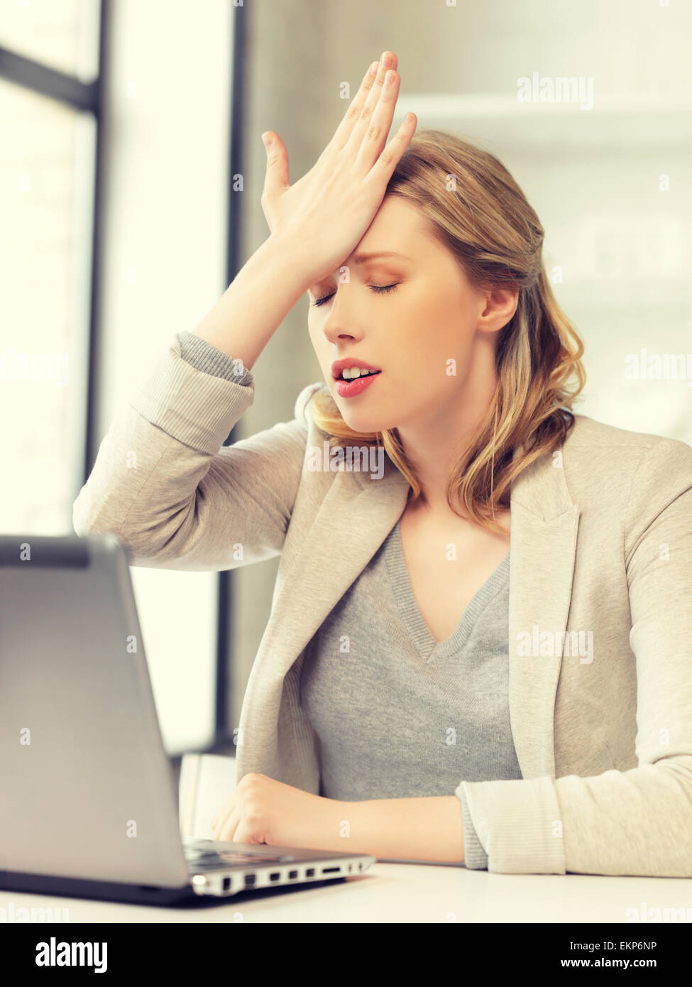 stressed woman with laptop computer Stock Photo - Alamy
