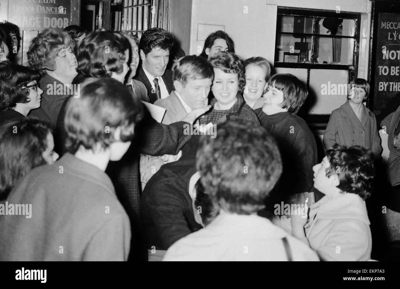 Singer Johnny Leyton surrounded by a crowds of girls as he tries to ...