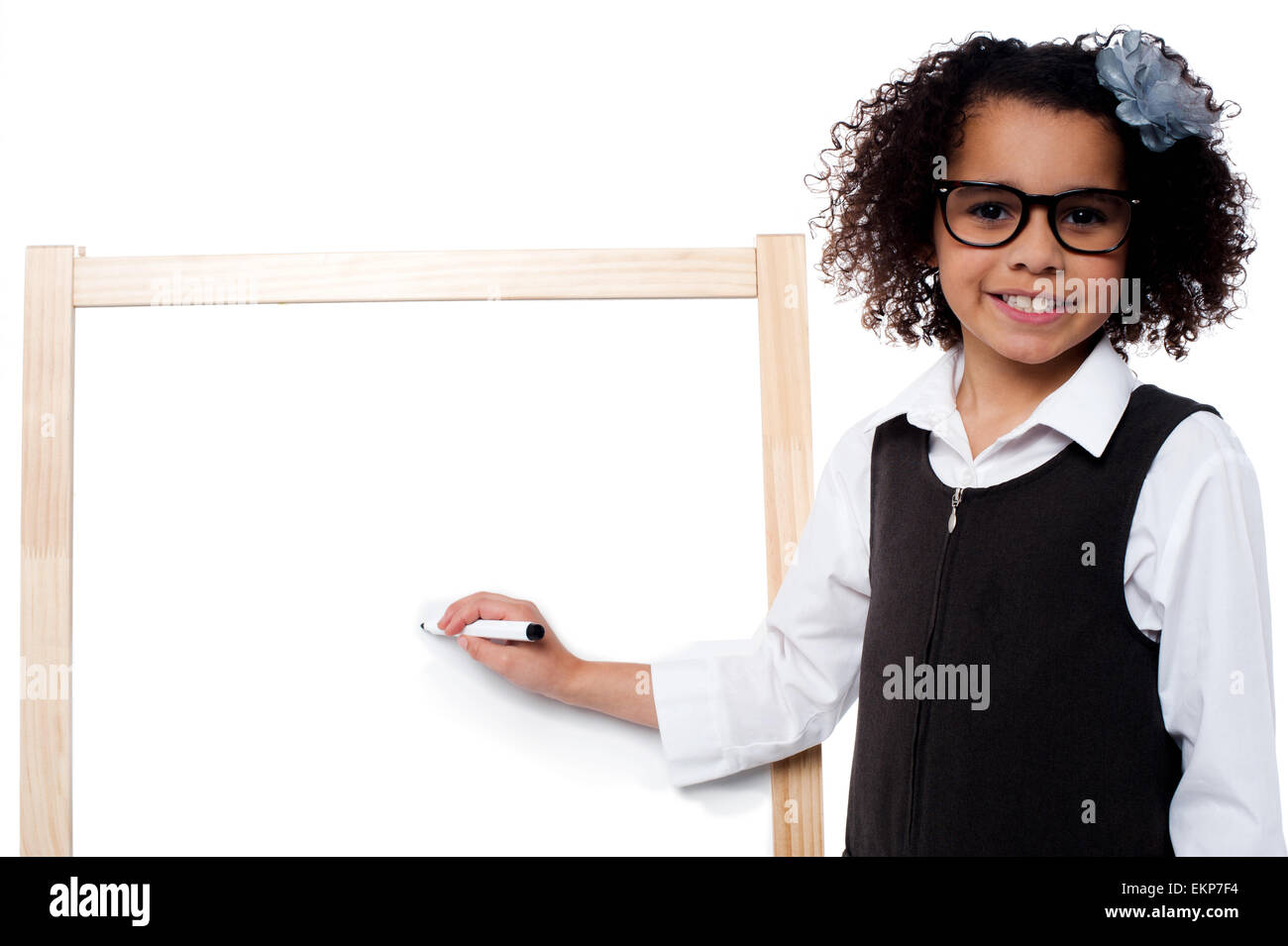 Young kid about to write on whiteboard Stock Photo - Alamy