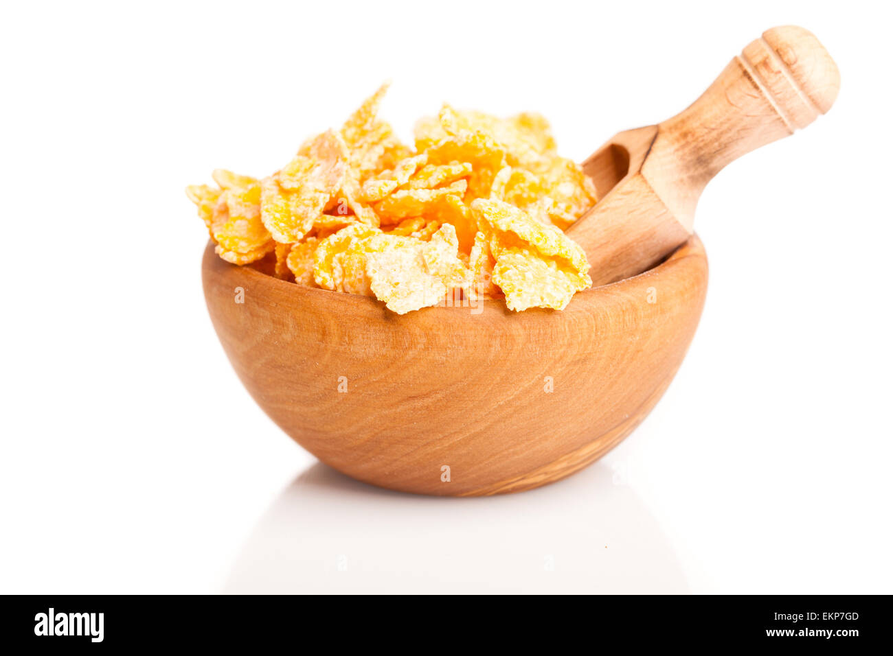 Cornflakes in a wooden bowl, isolated on white background Stock Photo ...