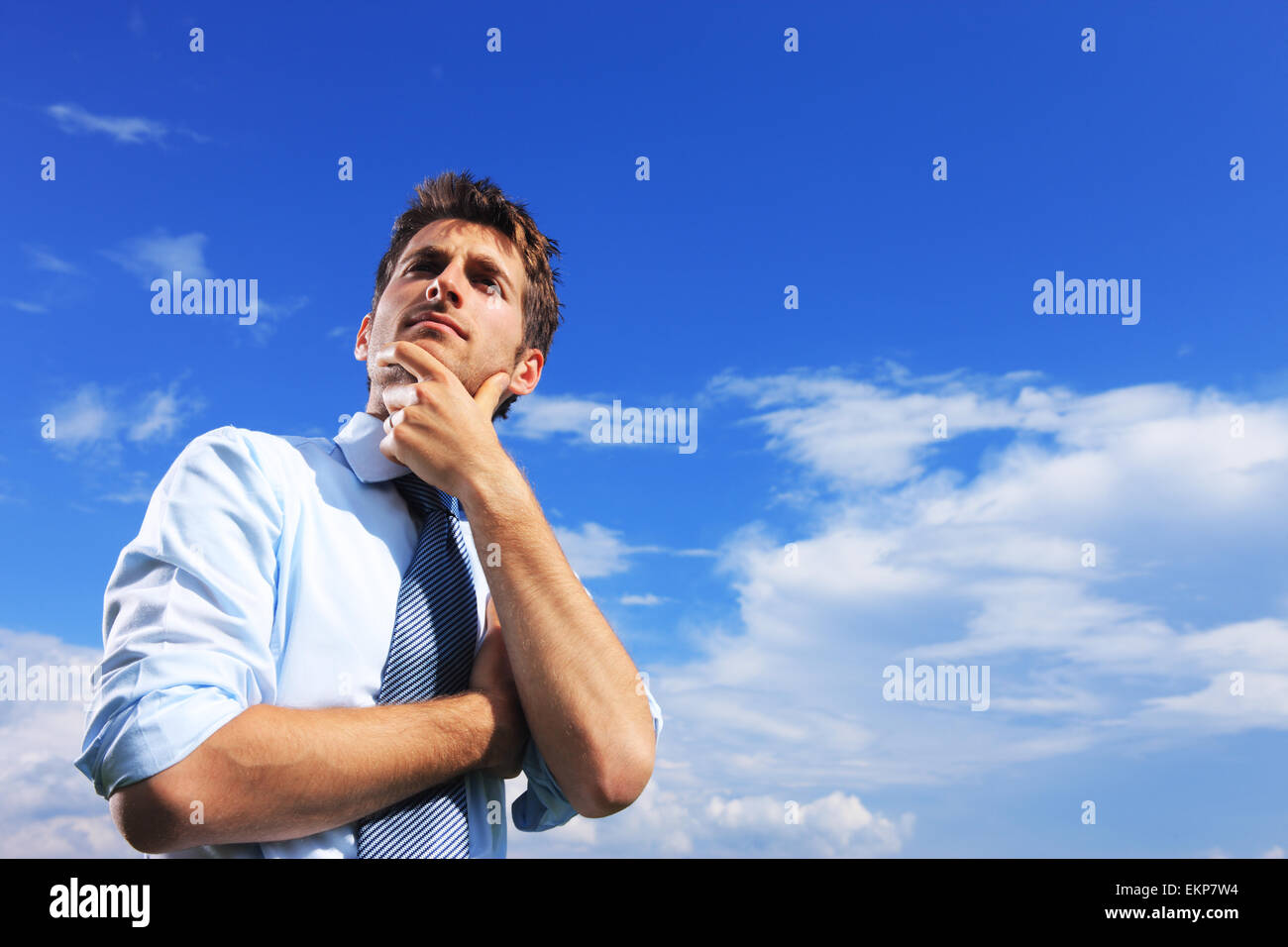 Young man thinking Stock Photo - Alamy