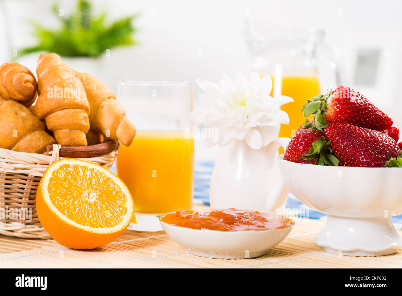 early breakfast, juice, croissants and jam Stock Photo - Alamy
