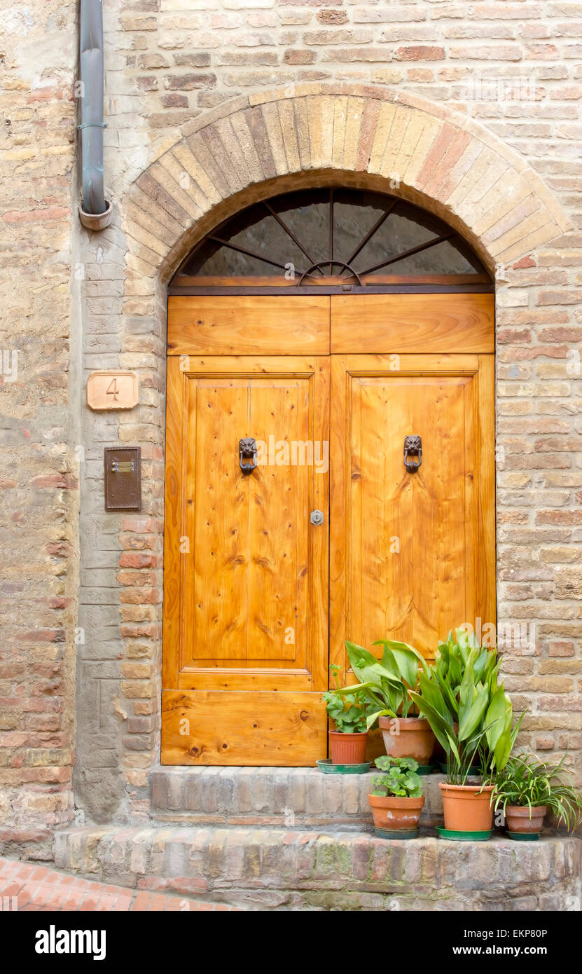 lovely tuscan doors, San Gimignano, Italy Stock Photo - Alamy