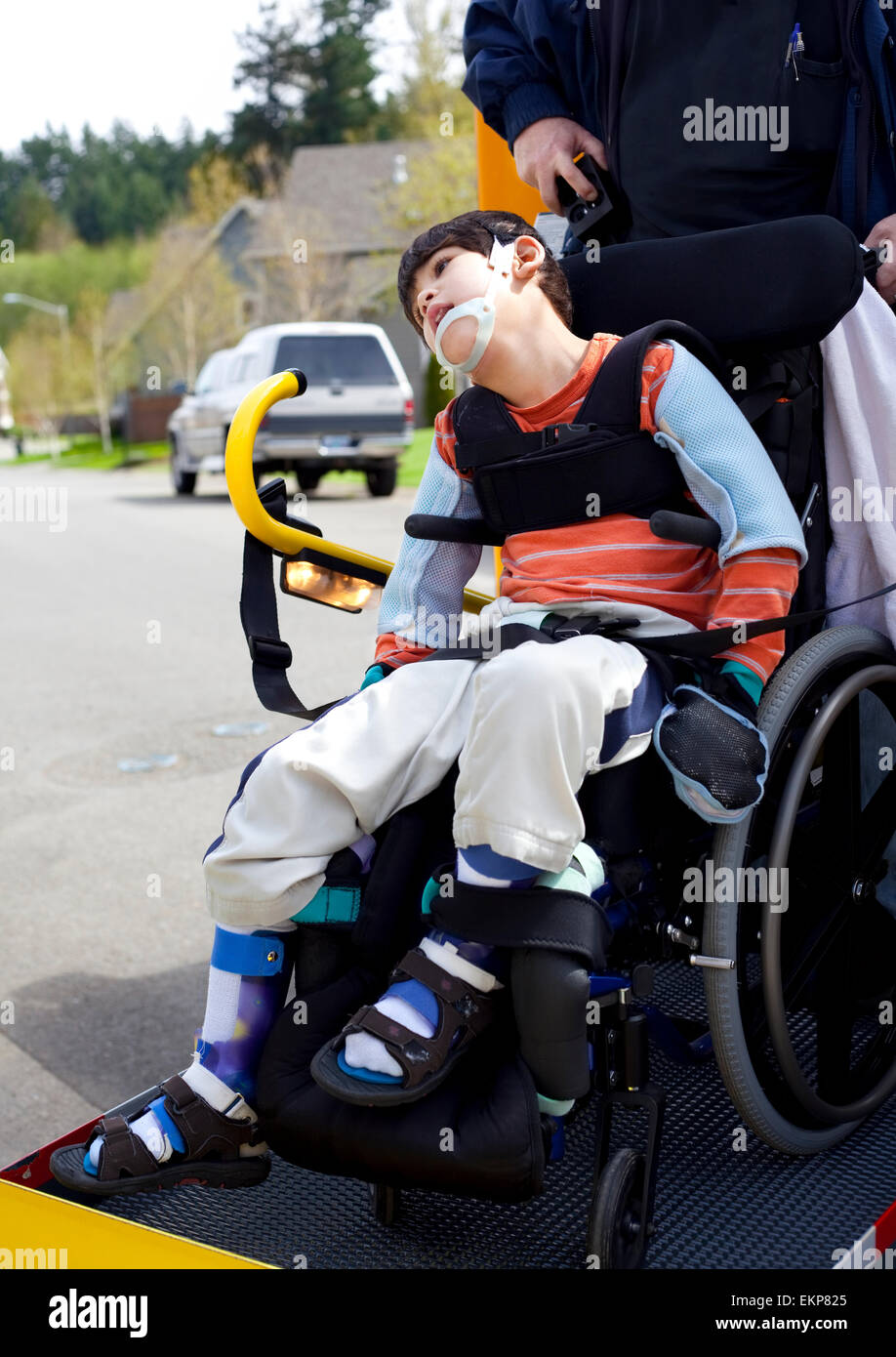 Disabled boy on school bus wheelchair lift Stock Photo - Alamy