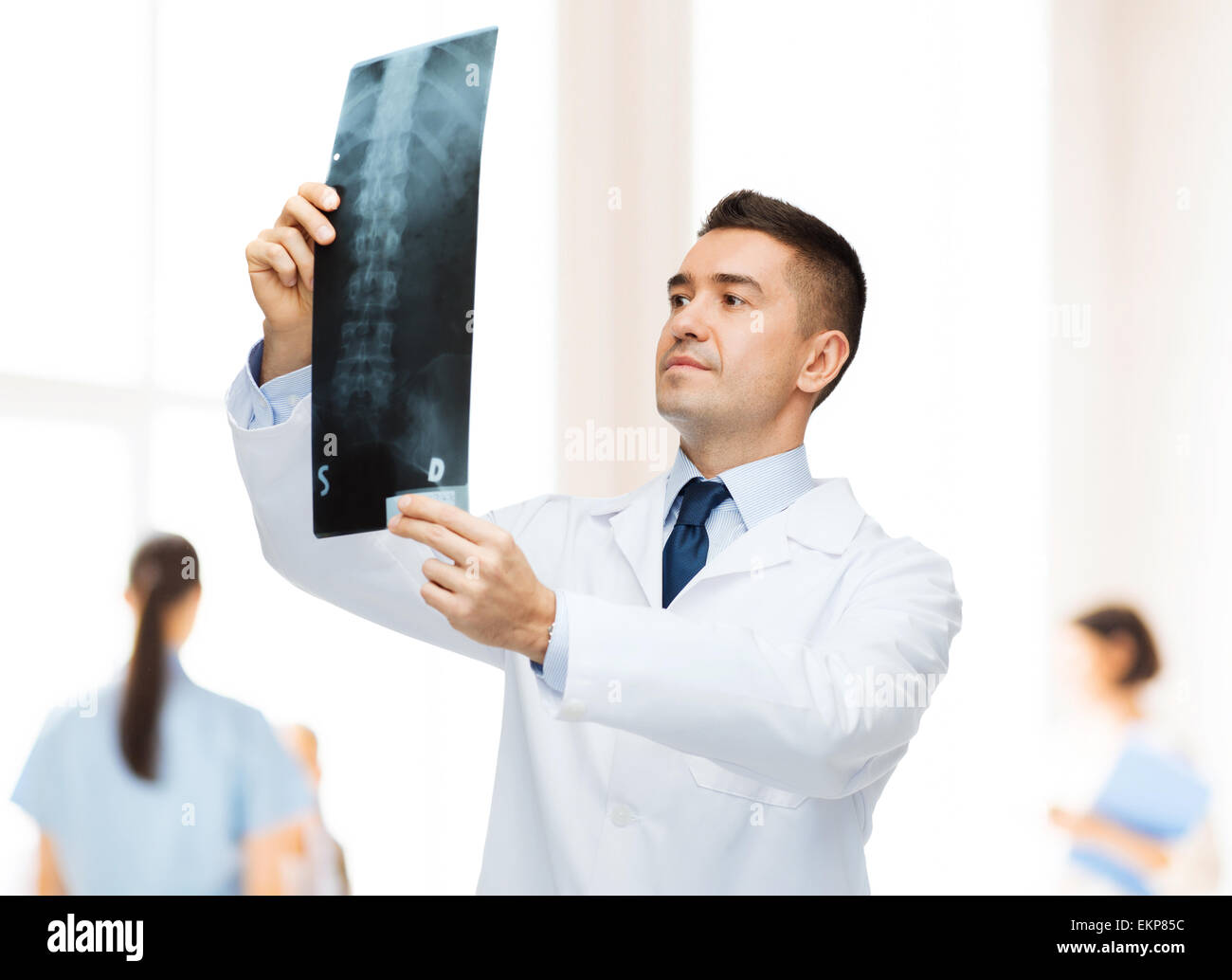 male doctor looking at x-ray in hospital Stock Photo - Alamy