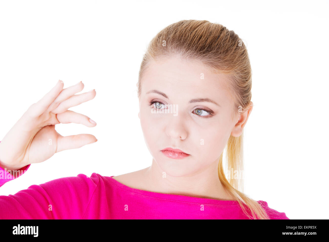 Woman showing something small Stock Photo - Alamy Woman showing something small Stock Photo - Alamy