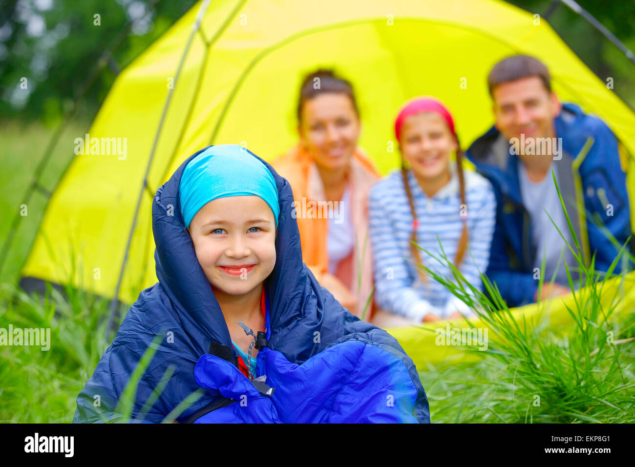 Young girl camping Stock Photo - Alamy